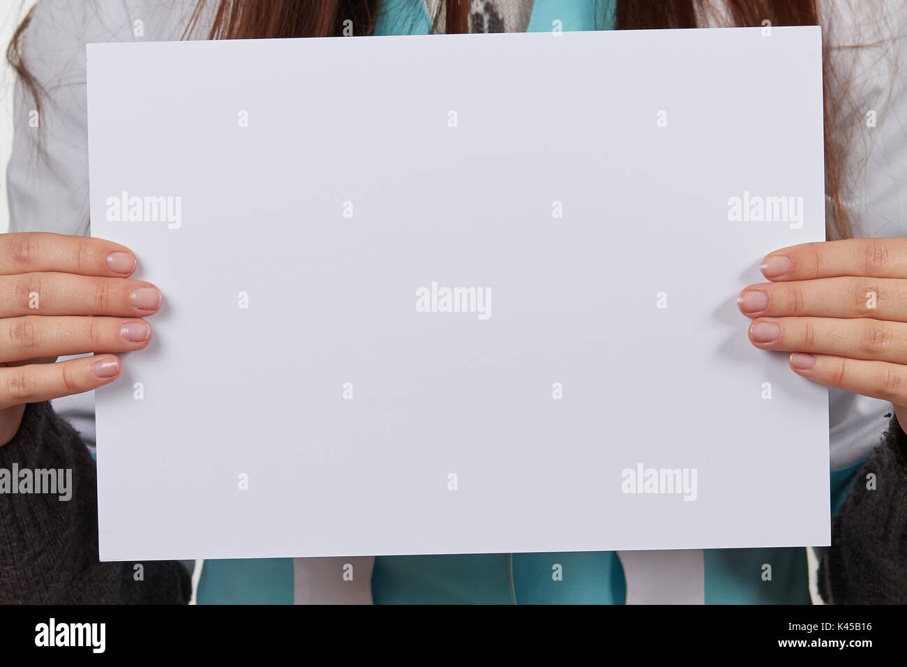 Hand holding paper isolated on white Stock Photo - Alamy