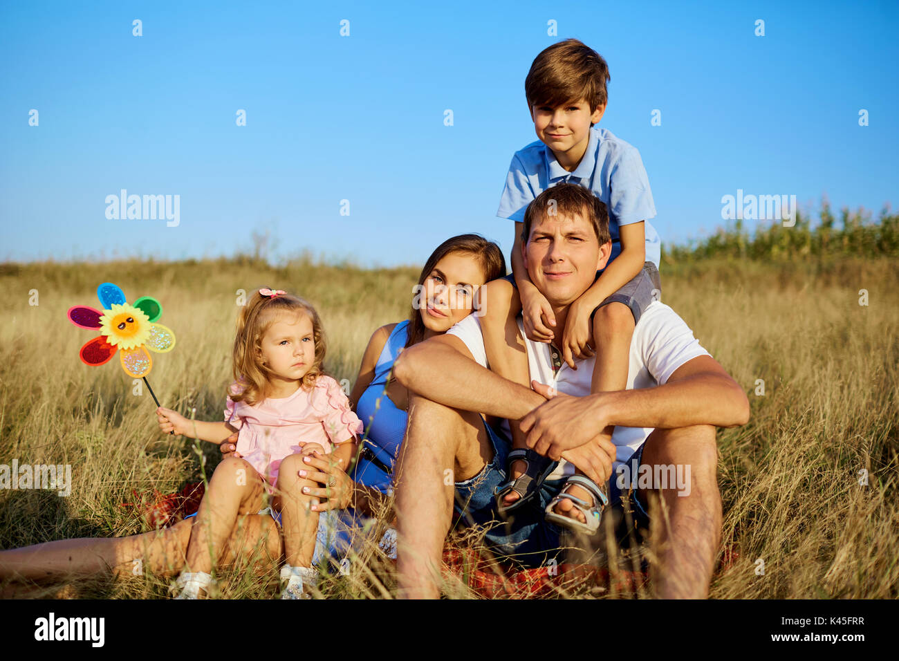 Happy family in nature Stock Photo - Alamy