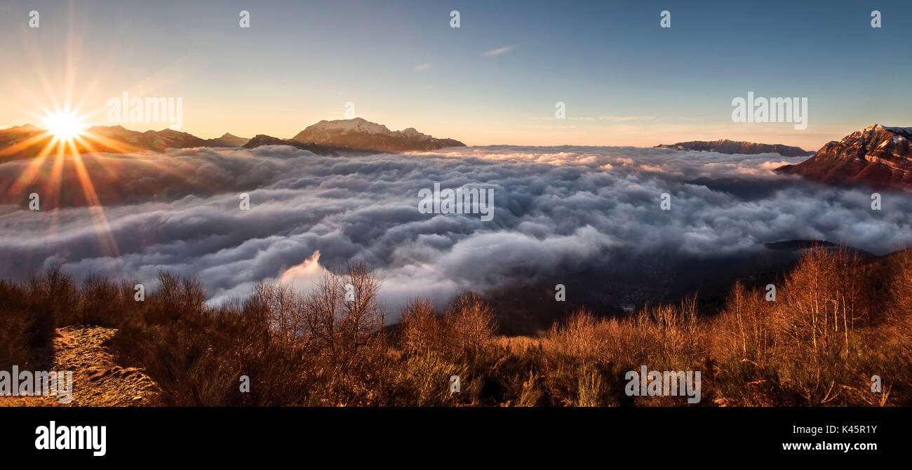 Italy, Lombardy, Como district. Como Lake,Clouds carpet, dawn,mount ...
