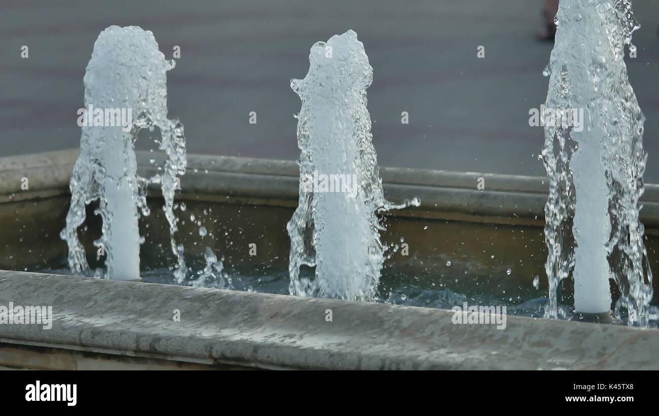 fountain of three jets of water splashing and a drop of water. Fountain ...