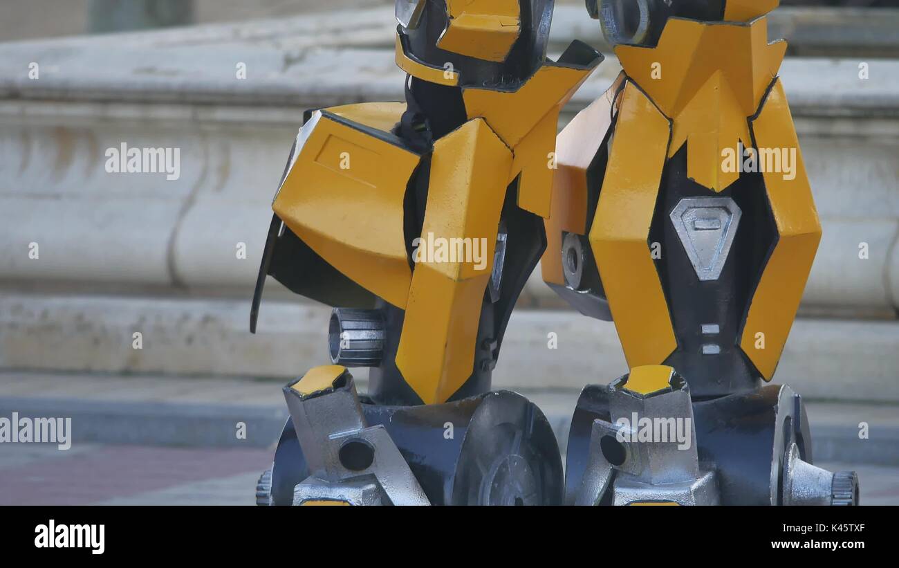 Feet of the foot of the yellow robot. Transformer robot terrible Stock ...