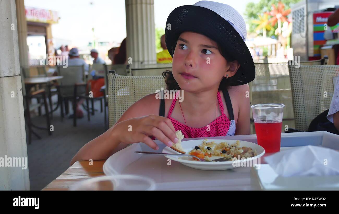 Girl teen eats at a cafe. Girl teenager eating lunch delicious outdoor ...
