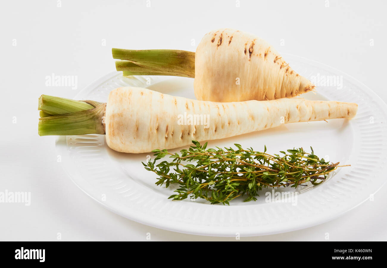 fresh parsnip on white background Stock Photo - Alamy