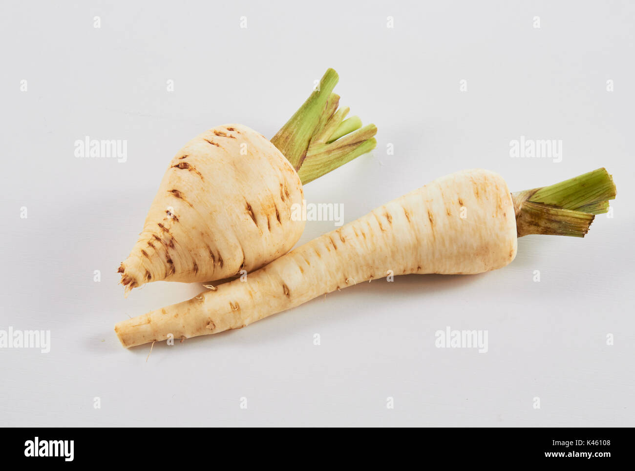 fresh parsnip on white background Stock Photo - Alamy