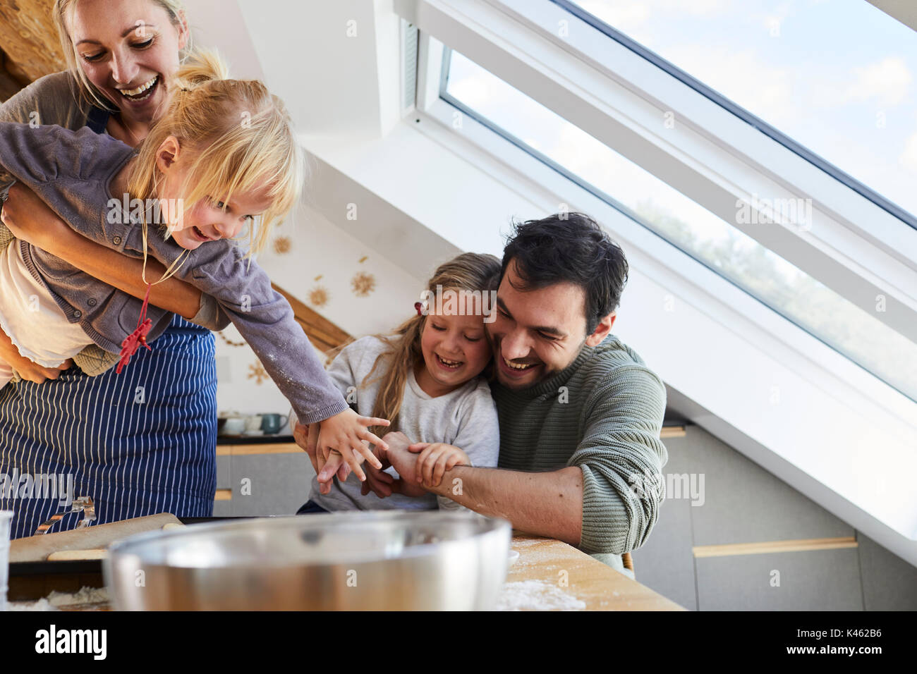 Happy family baking together hi-res stock photography and images - Alamy