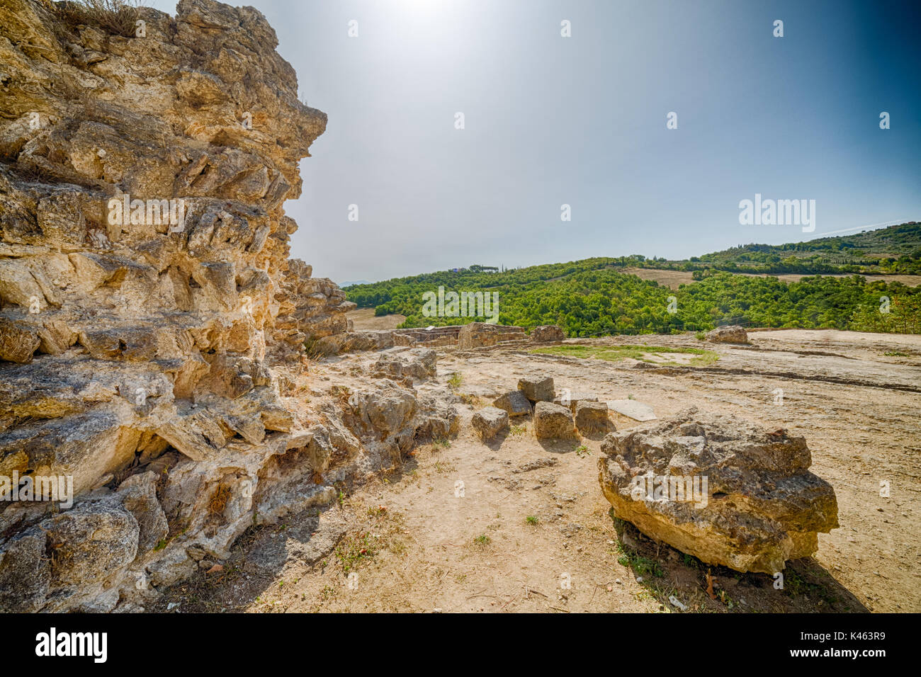 green weeds and arid rocks the region of badlands under the sun of ...