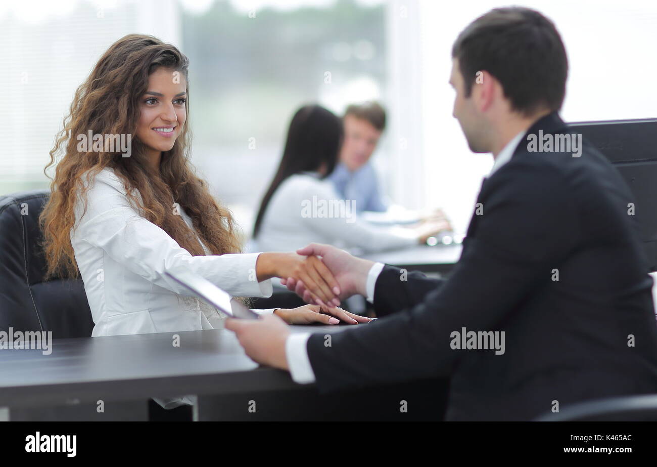 handshake Manager and the client in the office Stock Photo - Alamy