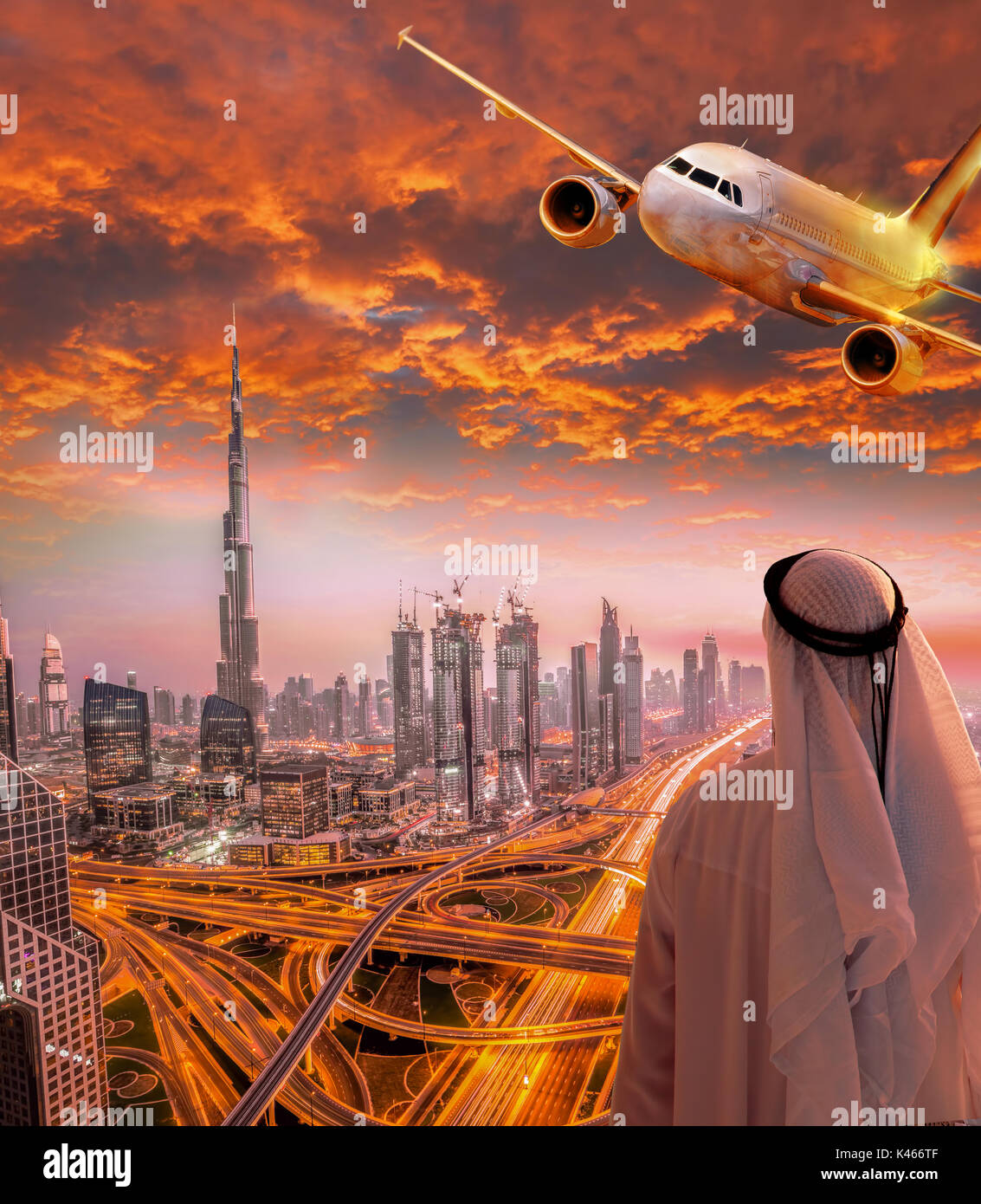 Arabian man with airplane flying over Dubai against colorful sunset in ...