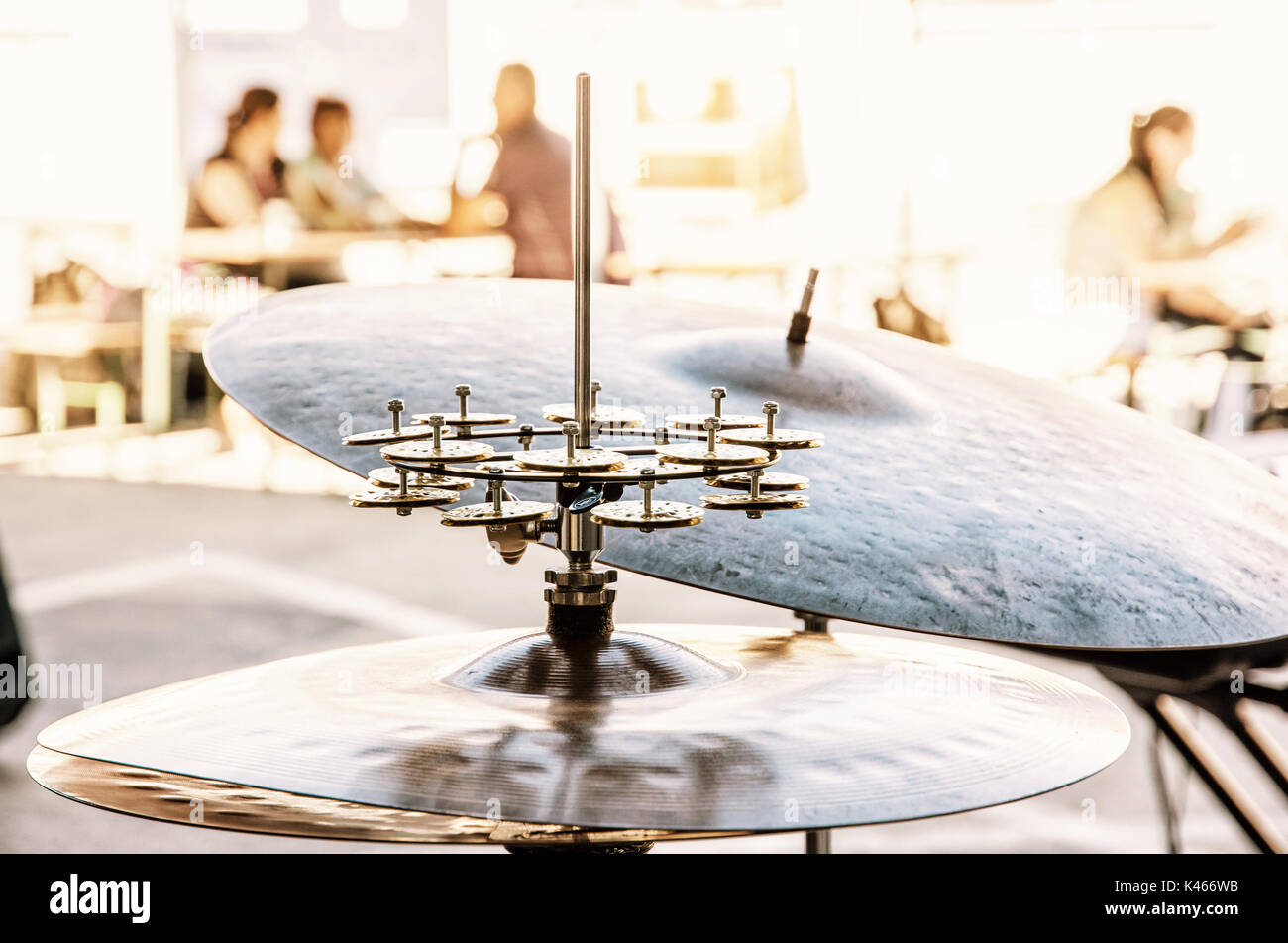 Detail of drums and cymbals. Concert scene with people. Yellow photo ...