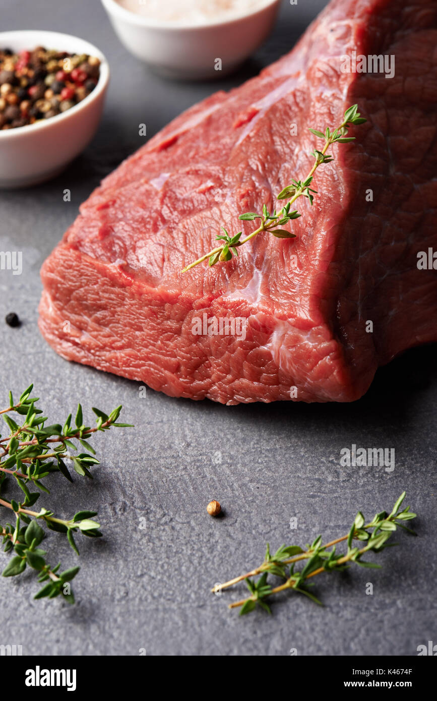 raw beaf meat and spices over stoun table Stock Photo - Alamy