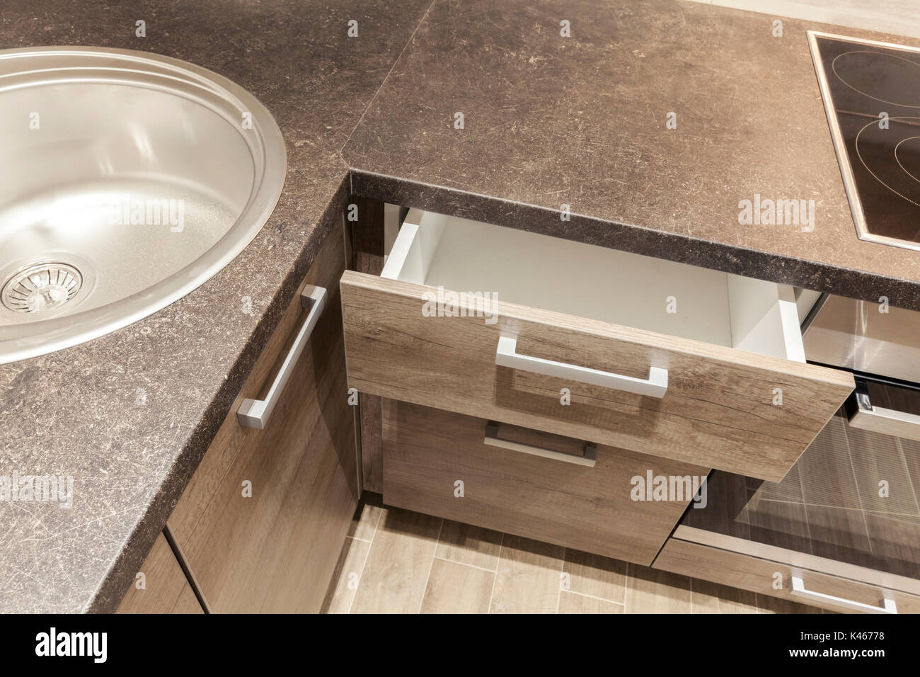 kitchen counter with sink and drawers open Stock Photo - Alamy