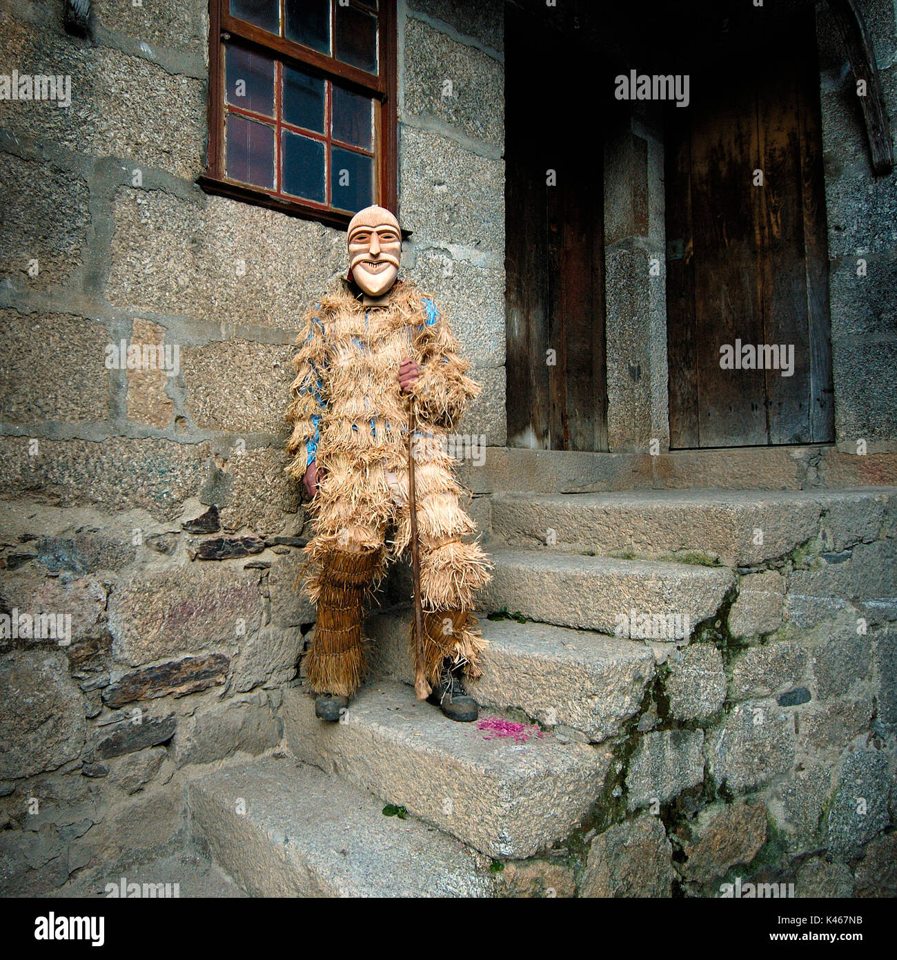 Traditional wooden mask and straw clothes during carnival. Lazarim ...