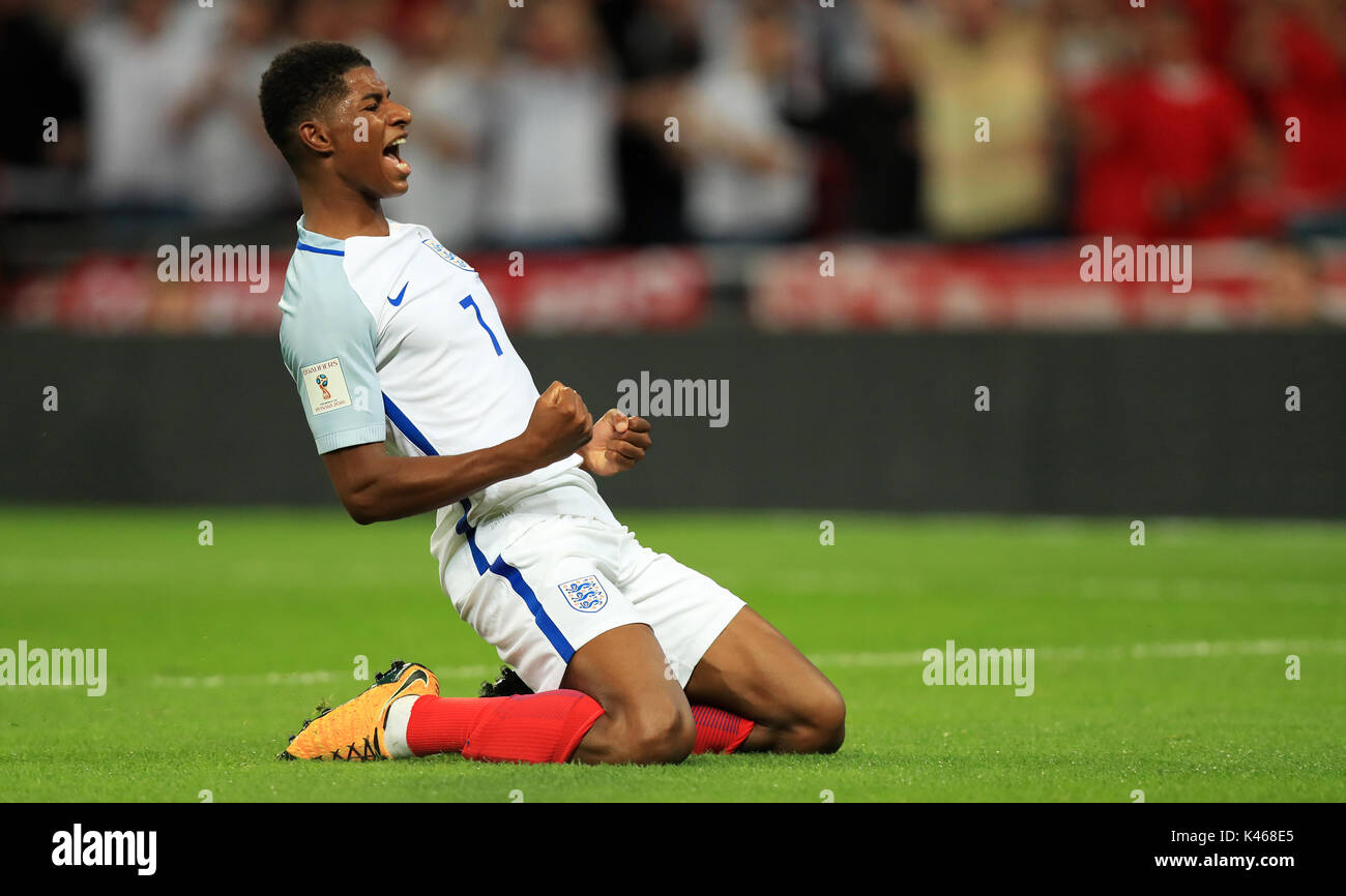 England's Marcus Rashford celebrates scoring his side's second goal ...