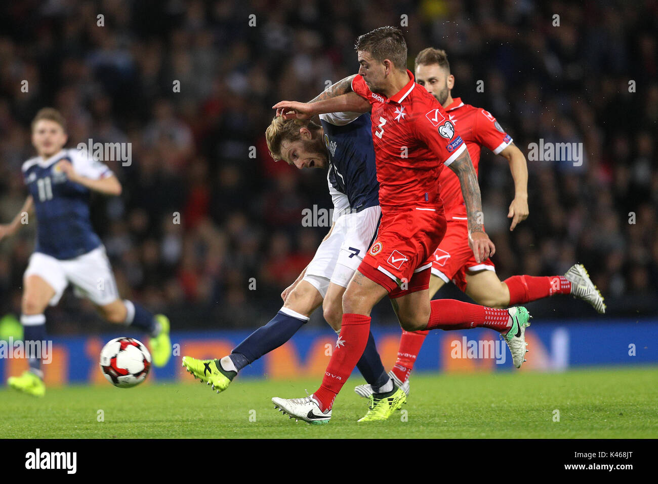 Scotland's Stuart Armstrong (left) in action with Malta's Sam Magri ...