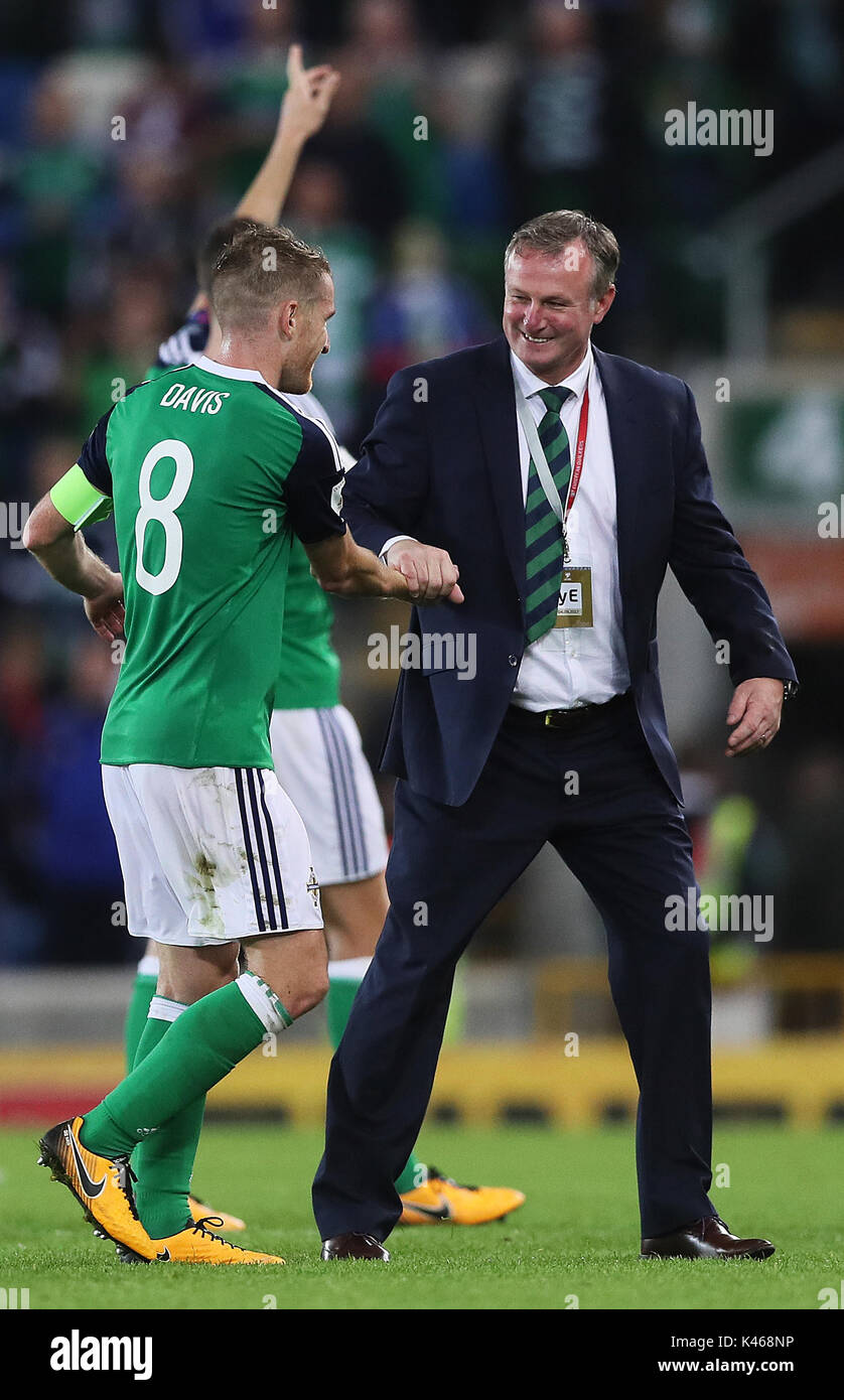 Northern Ireland manager Michael O'Neill celebrates with Steven Davis ...