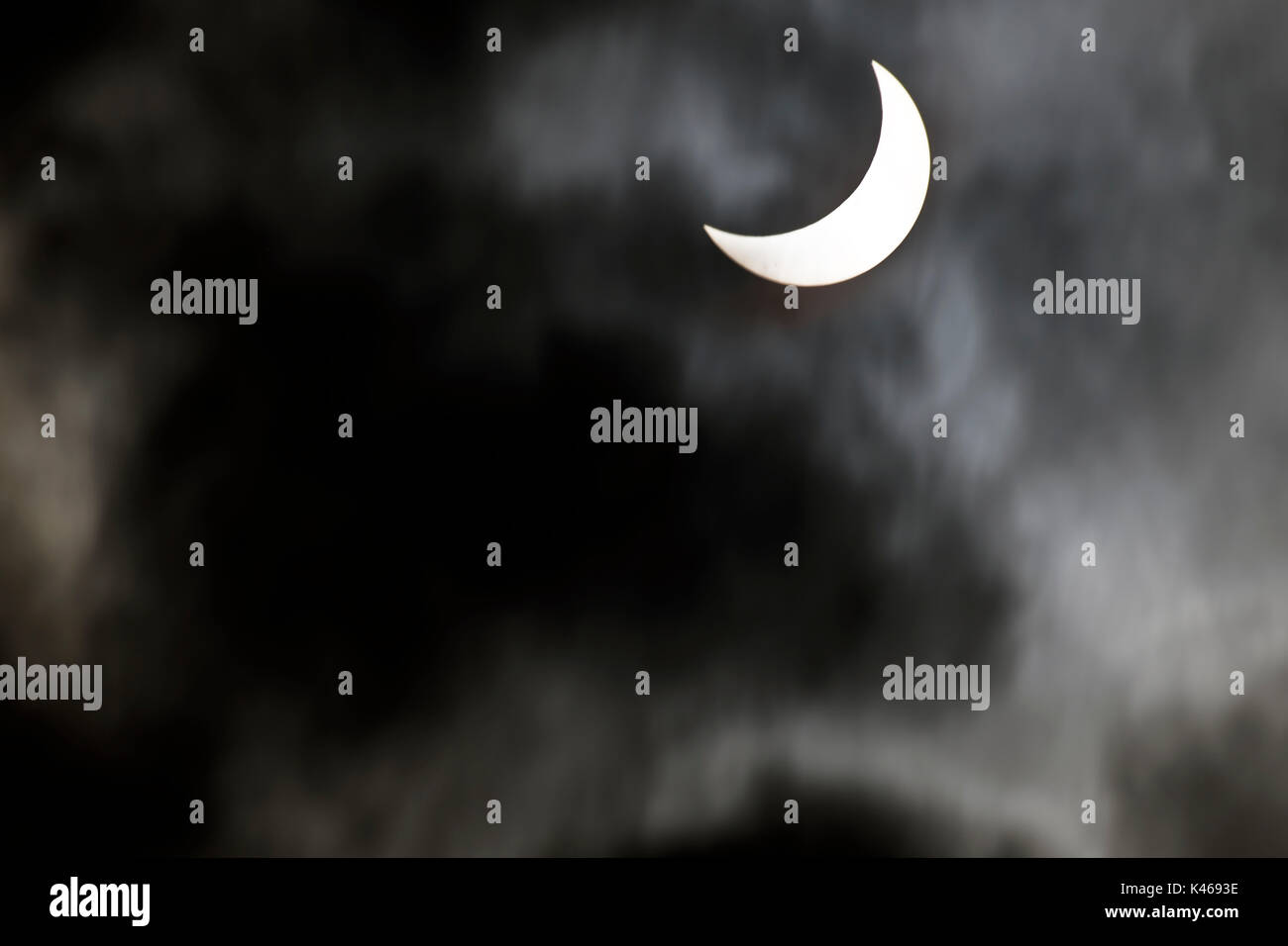 Partial solar eclipse under cloudy skies. Flagstaff, Arizona August 21 ...