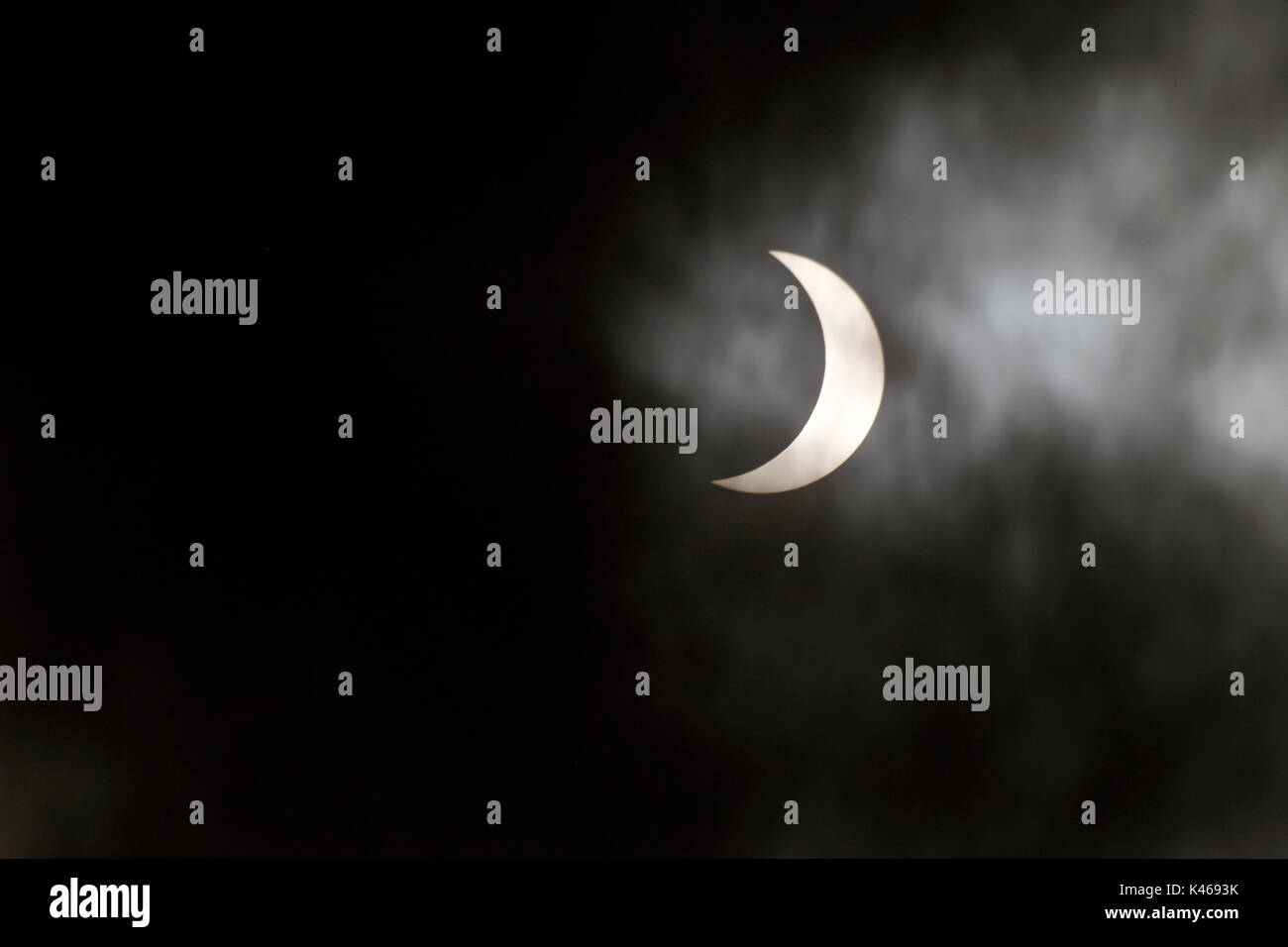 Partial solar eclipse under cloudy skies. Flagstaff, Arizona August 21 ...