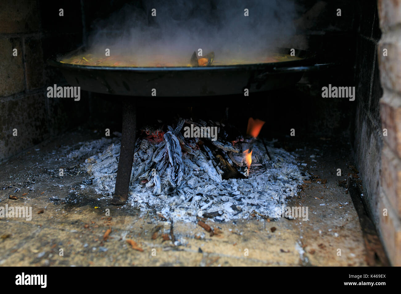 Typical spanish paella in the fire Stock Photo - Alamy