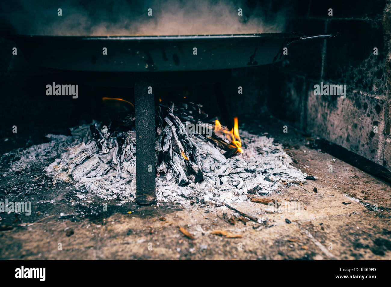 Typical spanish paella in the fire Stock Photo - Alamy