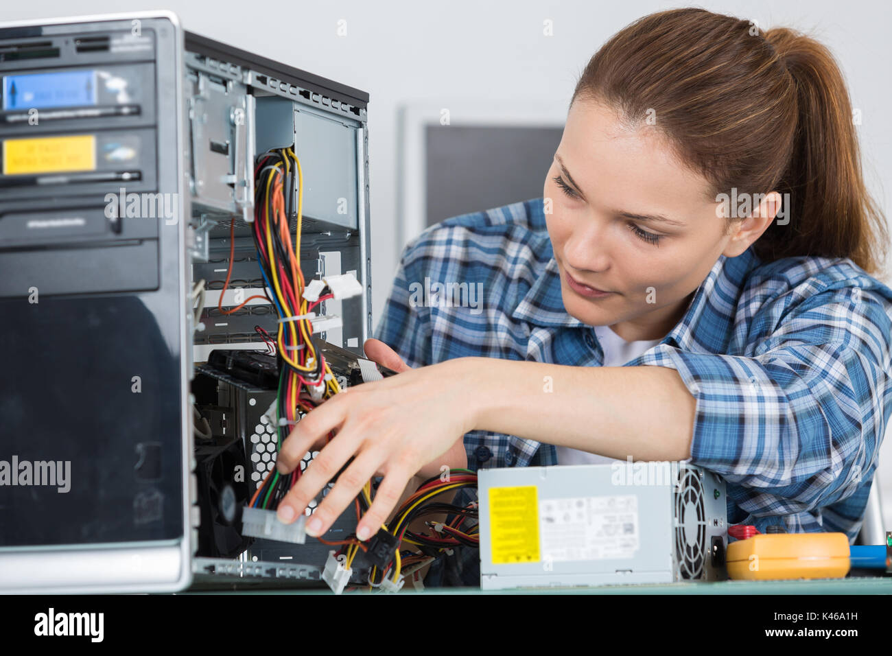 student girl in technology fixing computer hard drive Stock Photo - Alamy