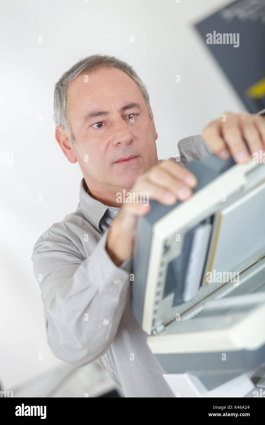 businessman hold ink cartridge to put into printer Stock Photo - Alamy