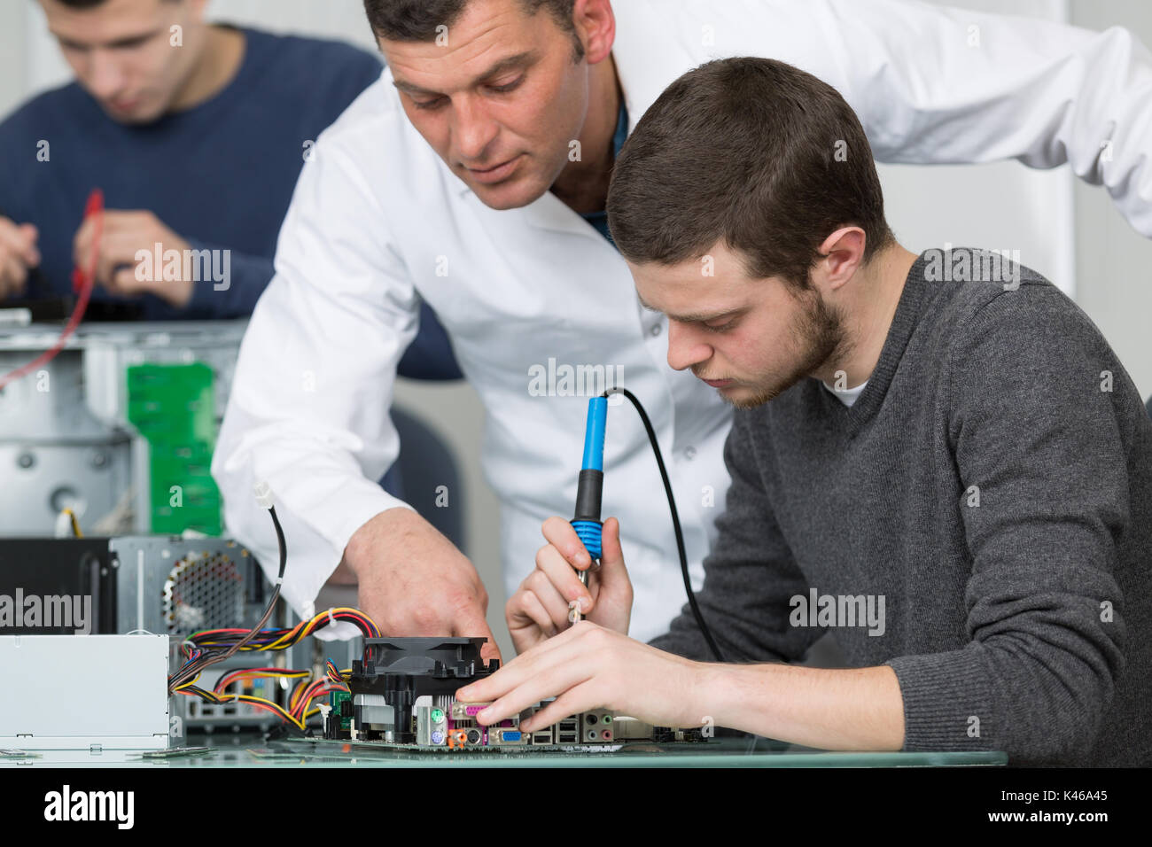 electronic students and teacher in class Stock Photo - Alamy