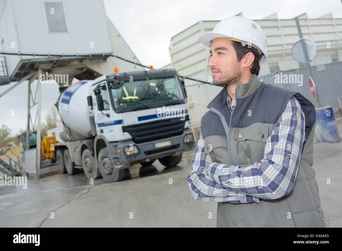 male engineer standing in front of truck on building site Stock Photo ...