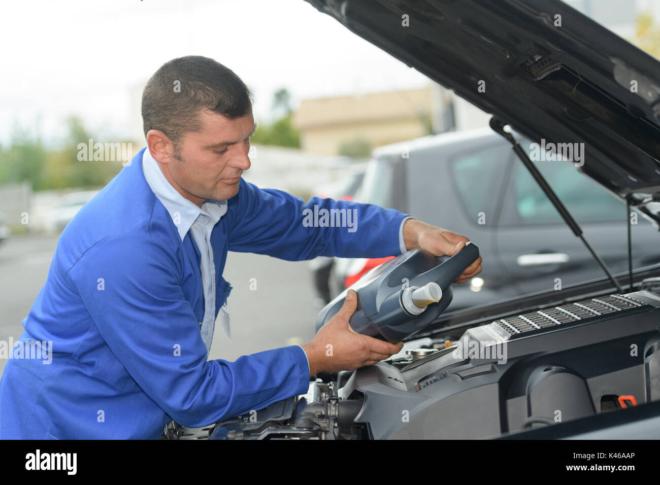 Pouring yellow new engine oil hi-res stock photography and images - Alamy