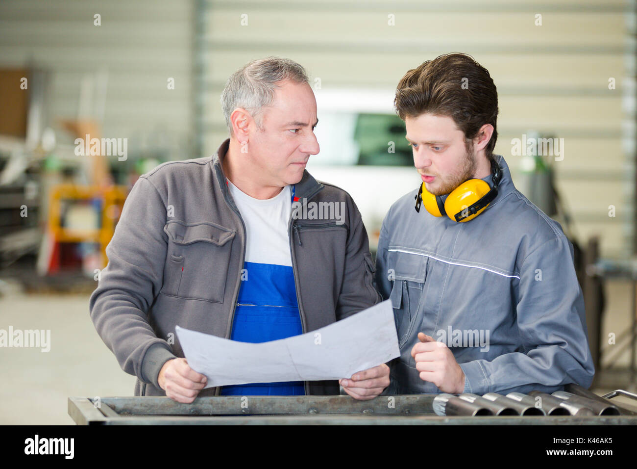 two laborers in office Stock Photo - Alamy