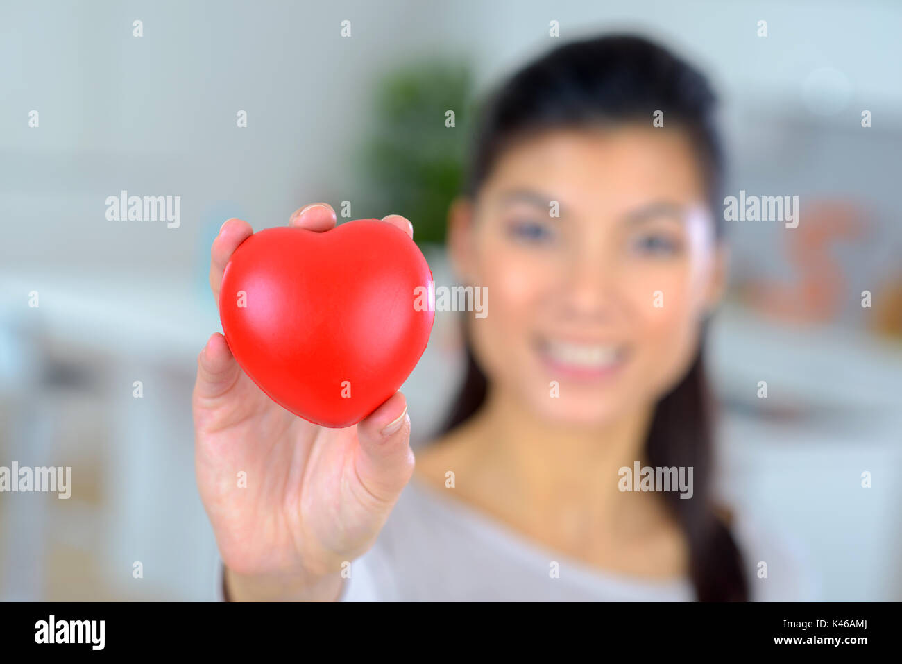 beautiful woman showing heart Stock Photo - Alamy