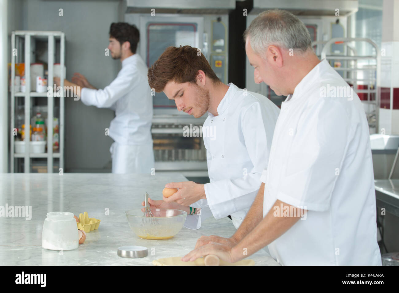 chief chef watching his assistant Stock Photo - Alamy