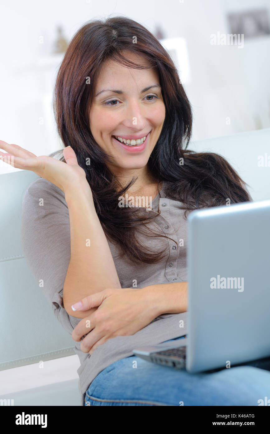 happy woman in front of her computer Stock Photo - Alamy