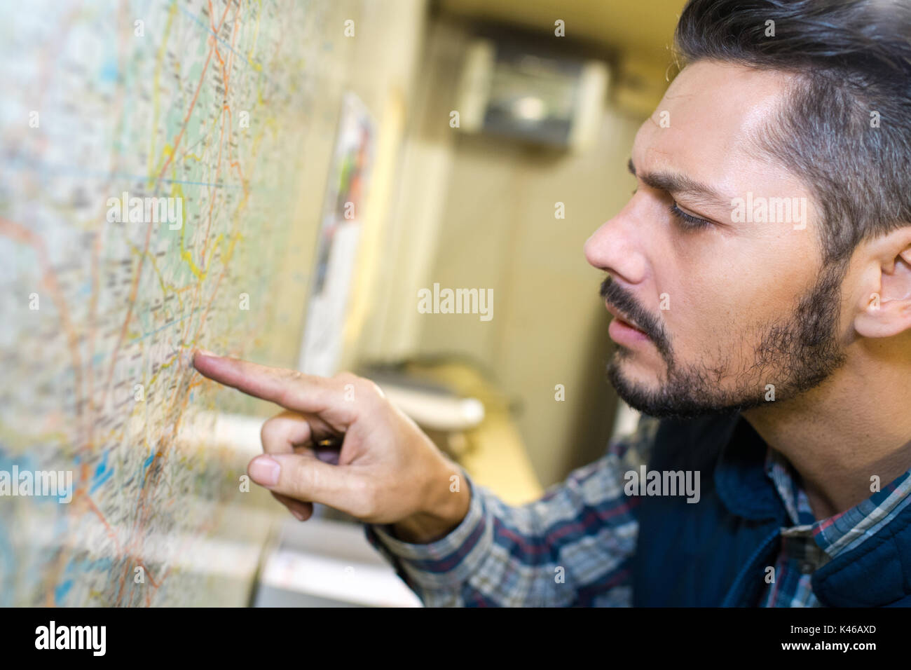 worker looking at a map Stock Photo - Alamy