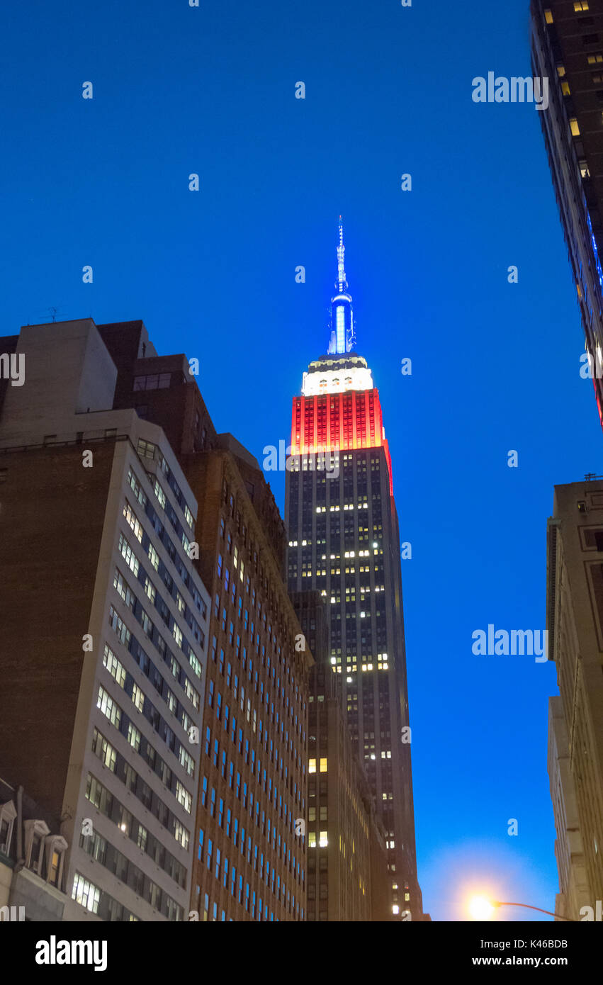 Empire State Building at night showing the colors of the American flag ...