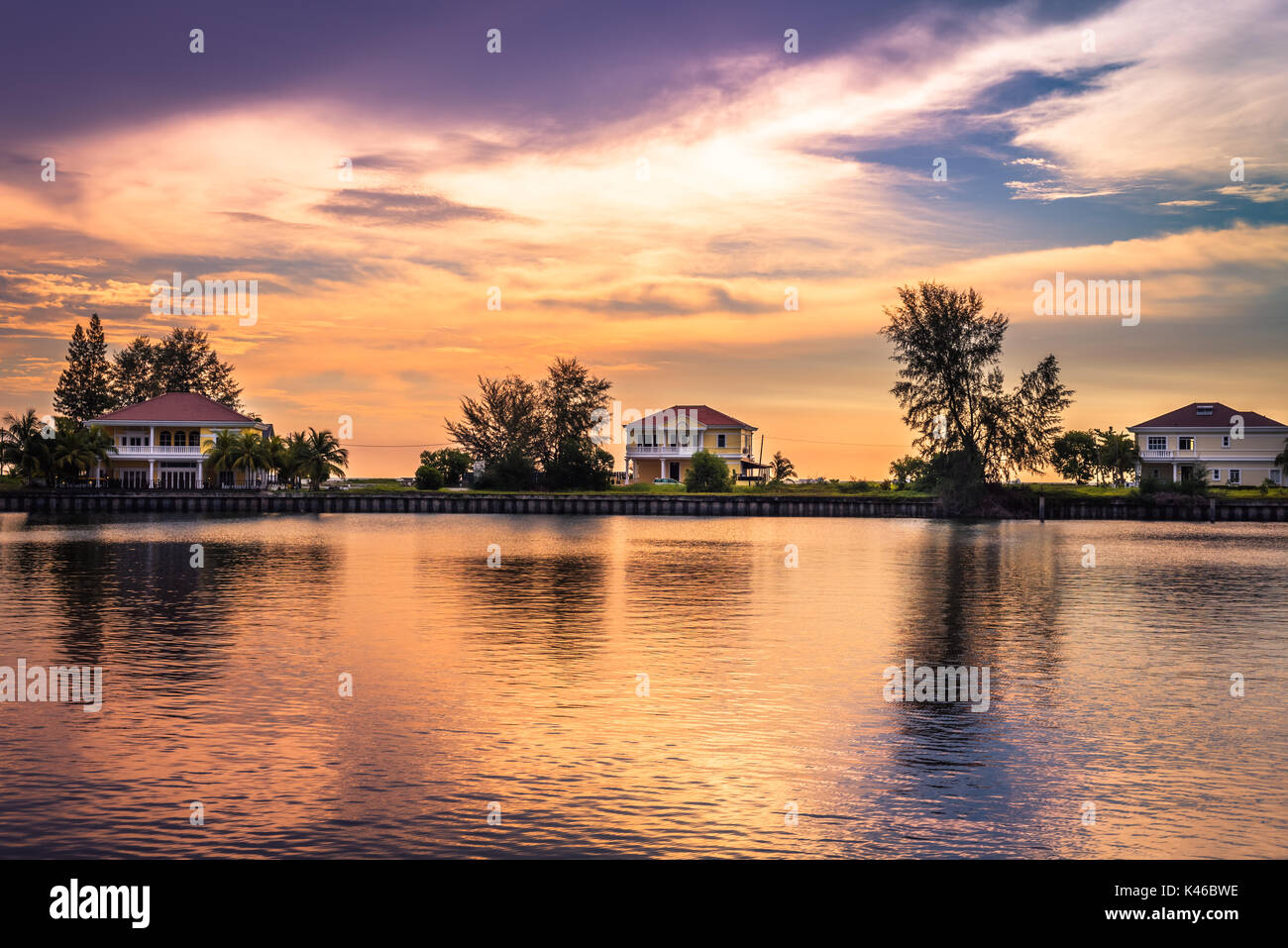 Houses on the Beach during Sunset Stock Photo - Alamy