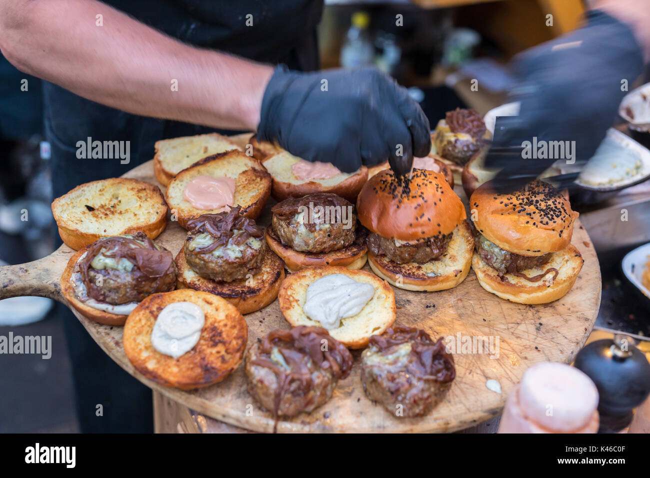 Chef making beef burgers outdoor on open kitchen international food ...