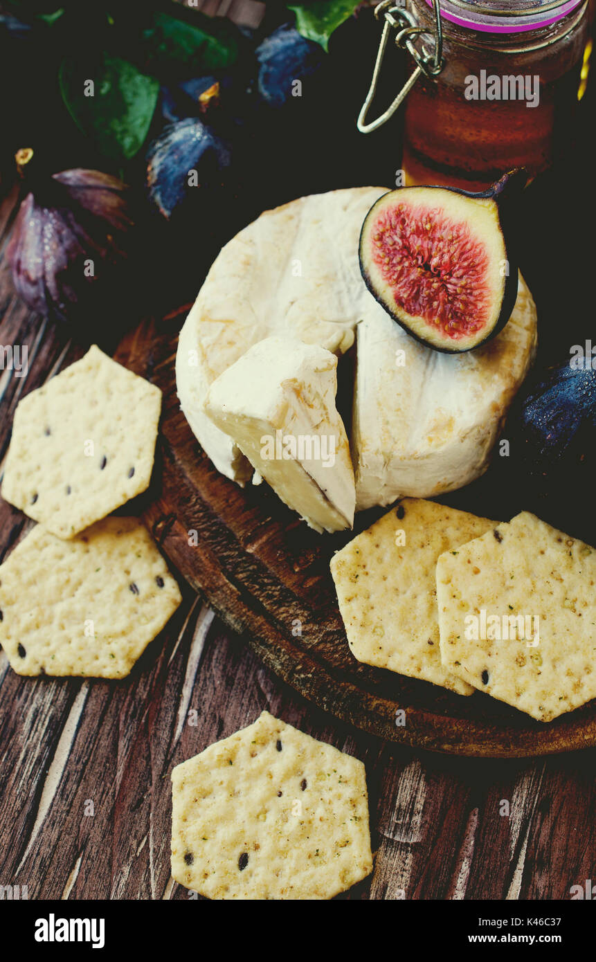 figs with cheese and honey on a wooden table selective focus Stock ...