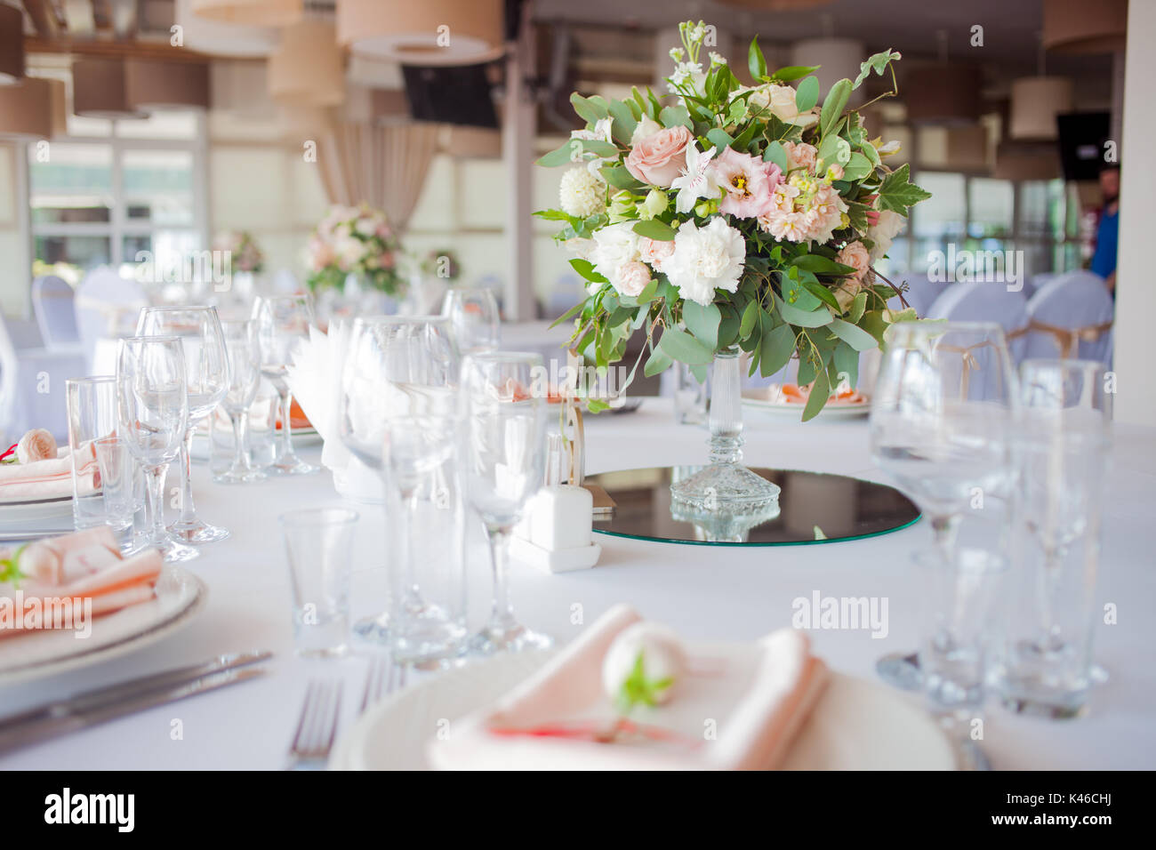 Wedding decor. Flowers in the restaurant, table setting Stock Photo - Alamy
