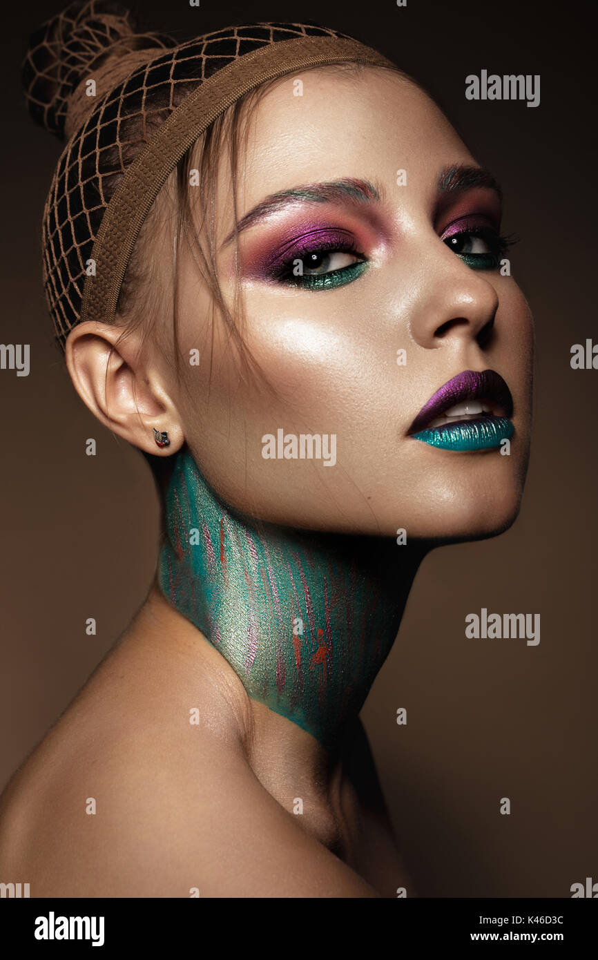 Beautiful girl with creative colorful makeup. Beauty face Stock Photo ...