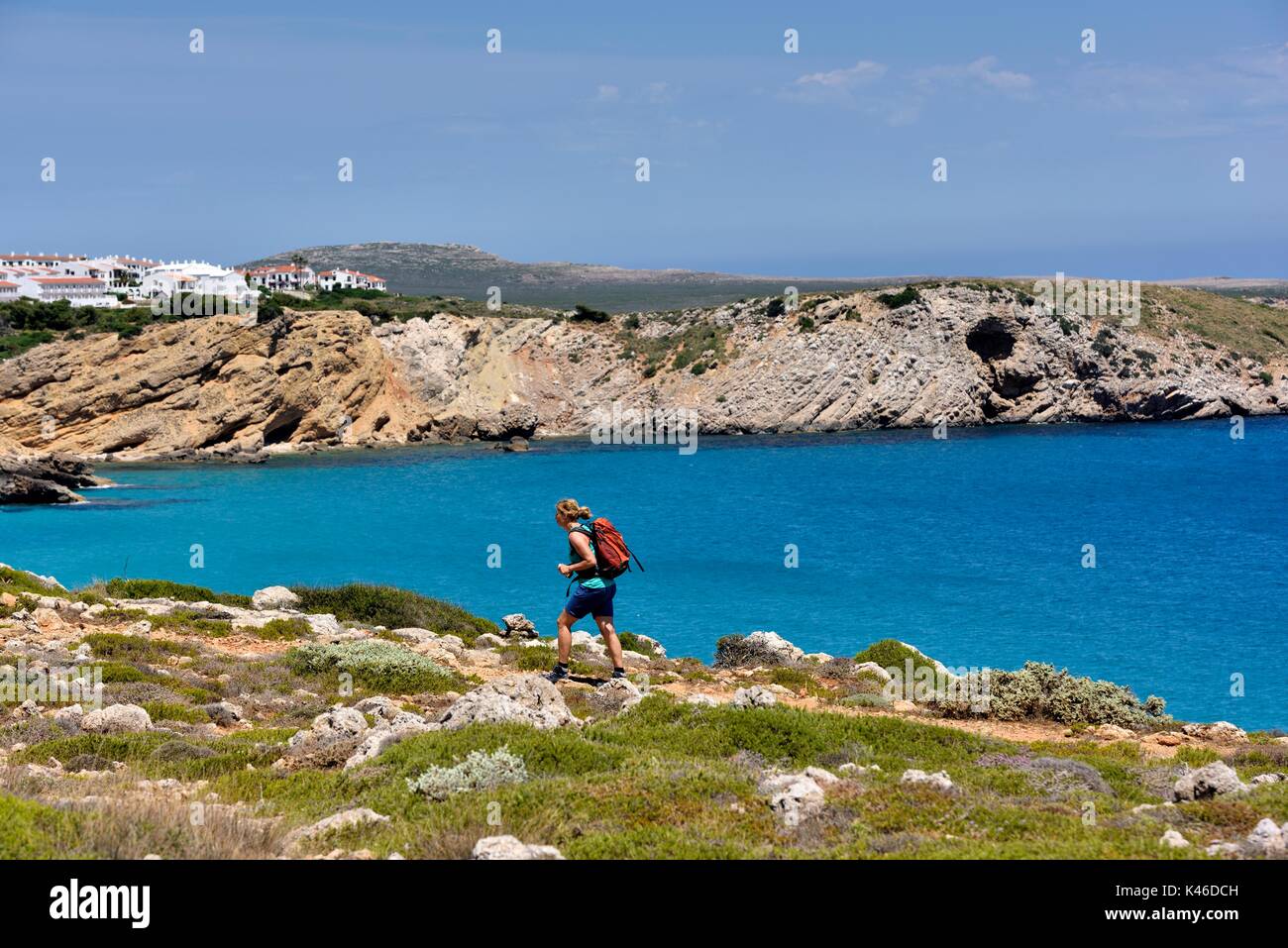 Lone woman walking the cami de cavalls arenal den castell menorca ...