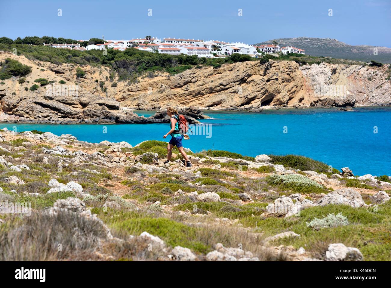 Lone woman walking the cami de cavalls arenal den castell menorca ...
