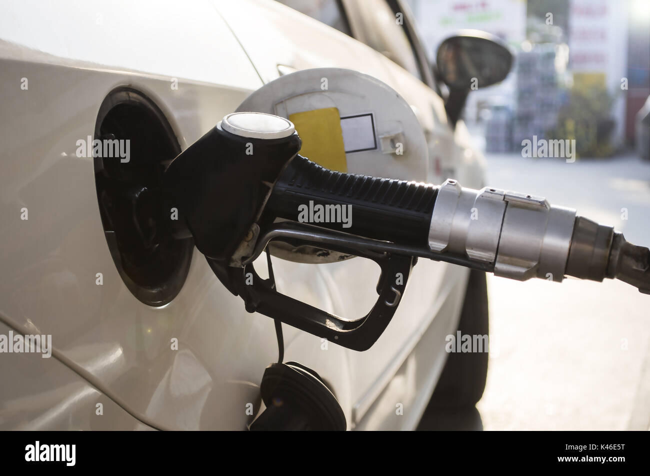Dripping gas pump nozzle Stock Photo - Alamy