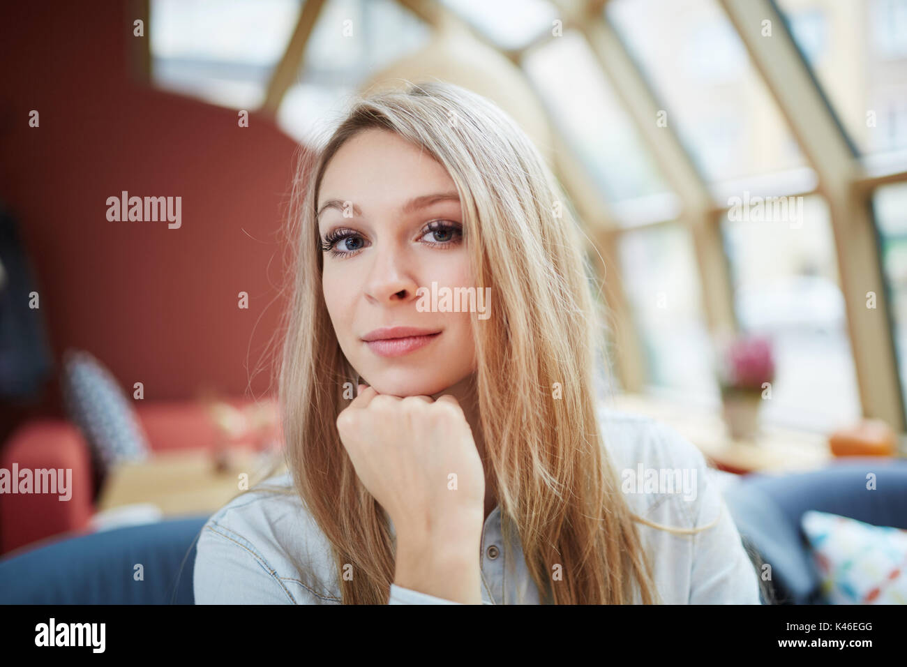 Front portrait of young beautiful woman propping her head on fist Stock ...