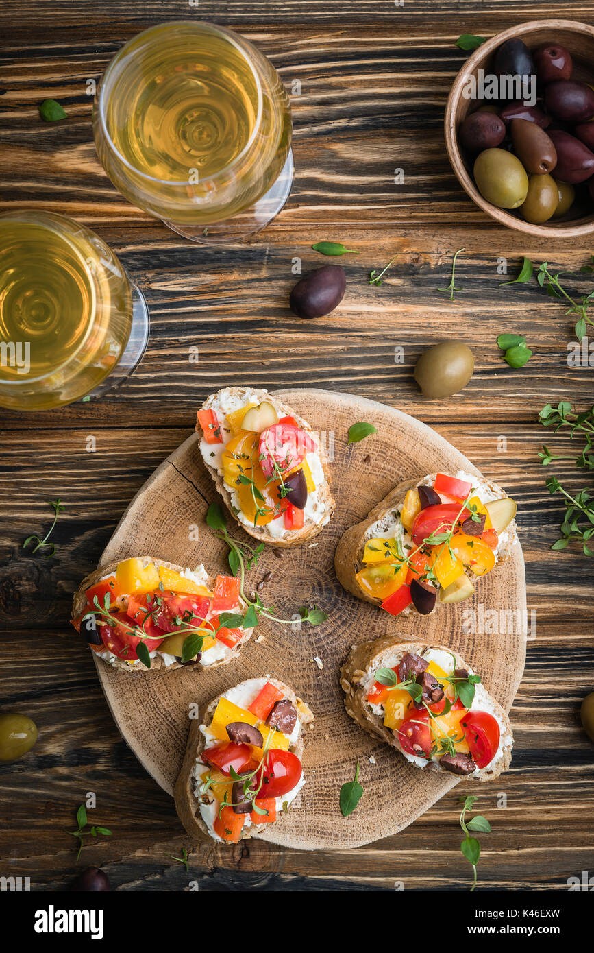 Traditional Italian appetizer, bruschetta with cottage cheese, cherry ...