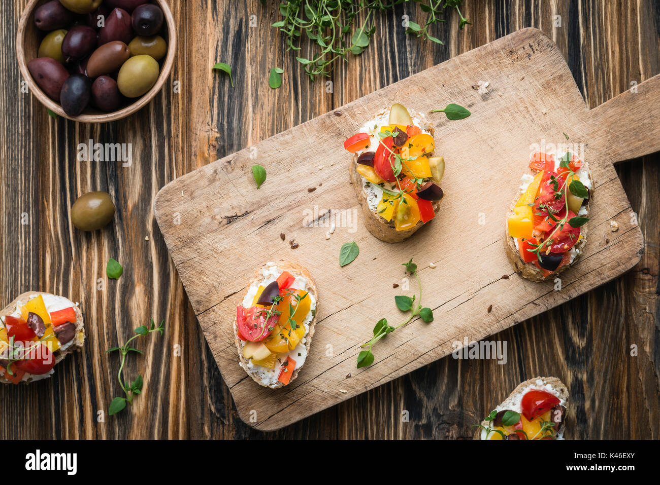 Traditional Italian appetizer, bruschetta with cottage cheese, cherry ...