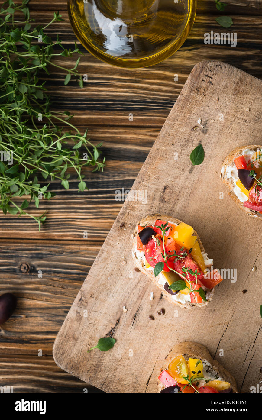 Traditional Italian appetizer, bruschetta with cottage cheese, cherry ...