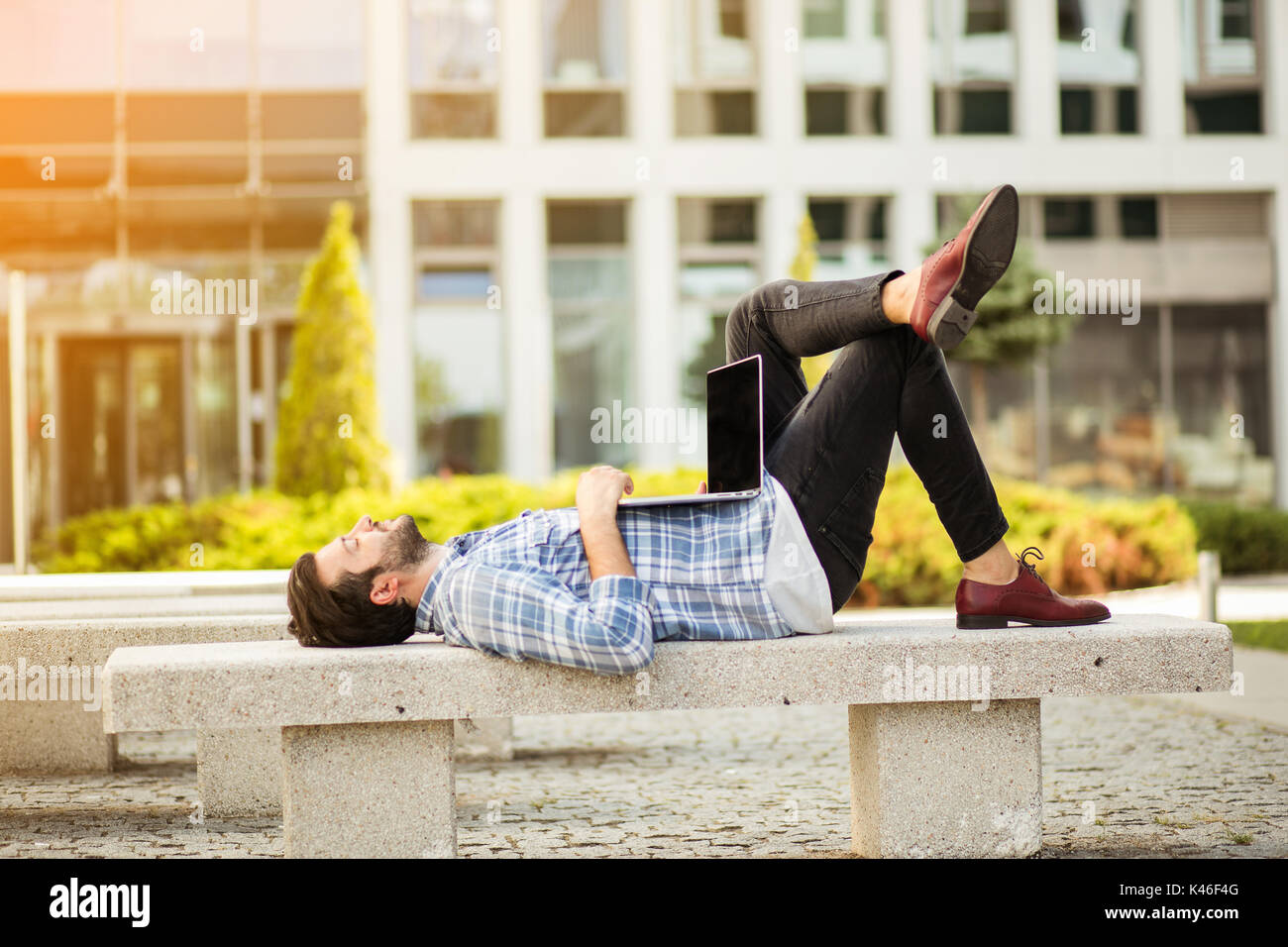 Businessman lying on bench hi-res stock photography and images - Alamy