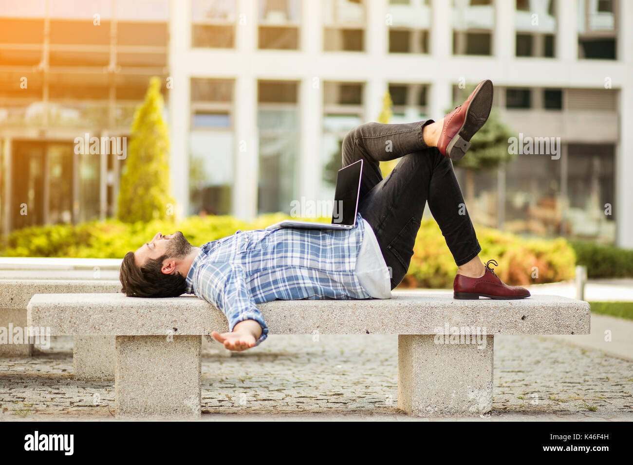 Young man lying on work bench hi-res stock photography and images - Alamy