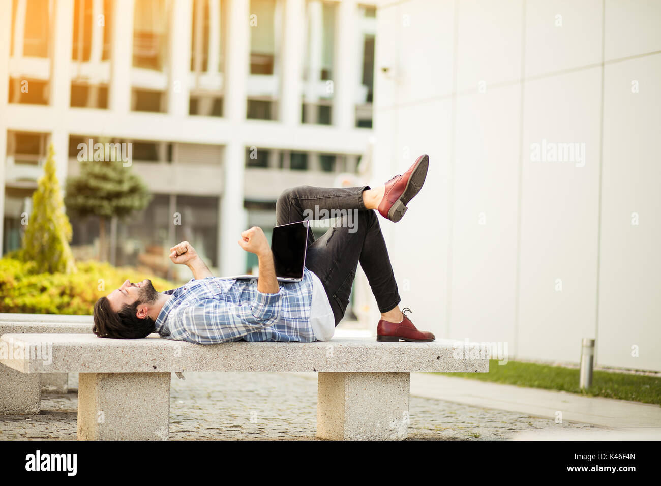 Young man lying on work bench hi-res stock photography and images - Alamy