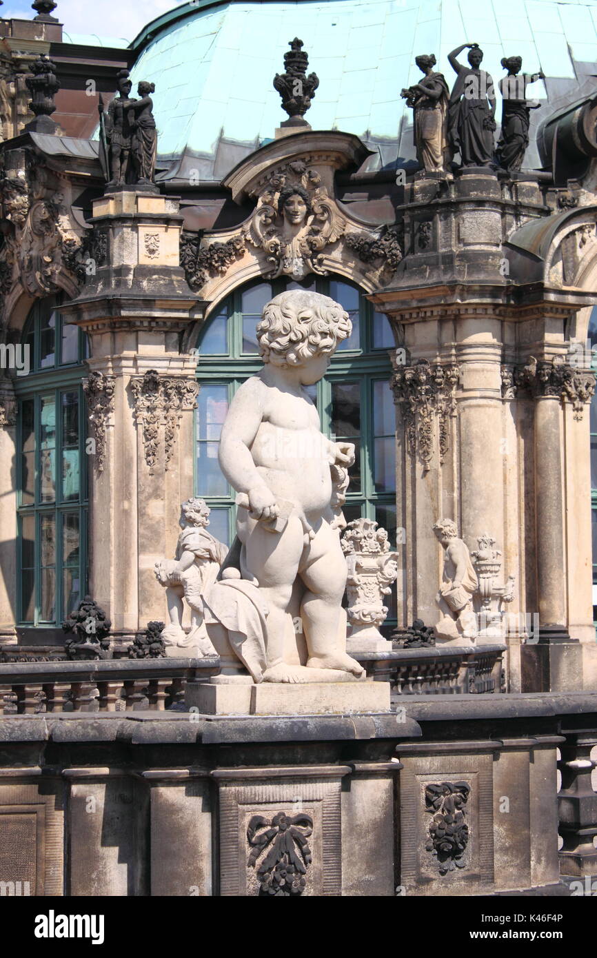 Baroque child statue on the roof of Dresden Zwinger, Germany Stock ...